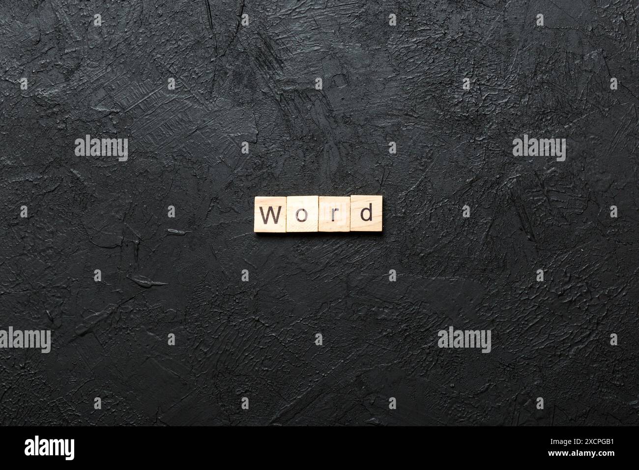 word written on wood block. WORD text on cement table for your desing, concept Stock Photo - Alamy