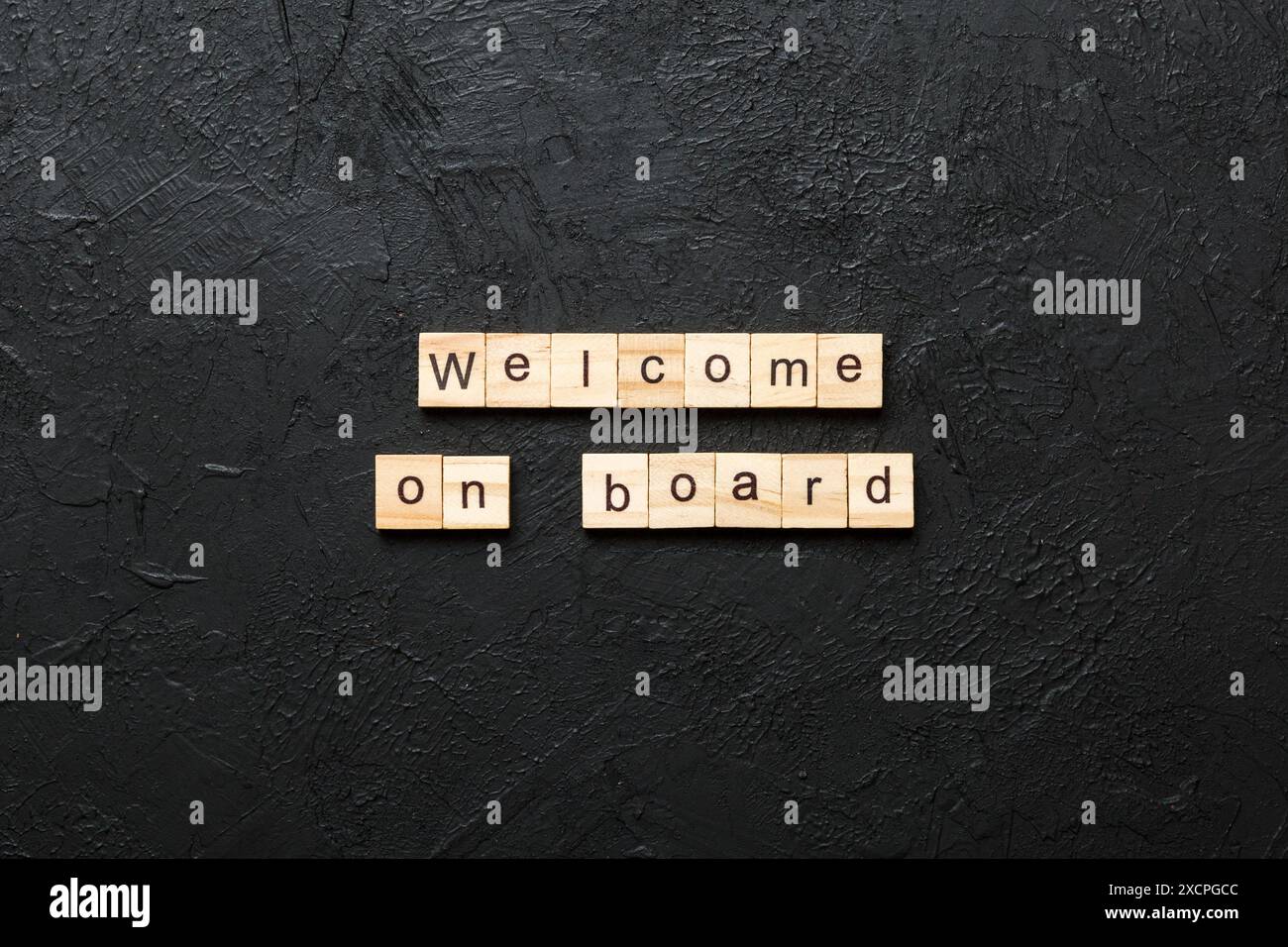 welcome on board word written on wood block. welcome on board text on ...