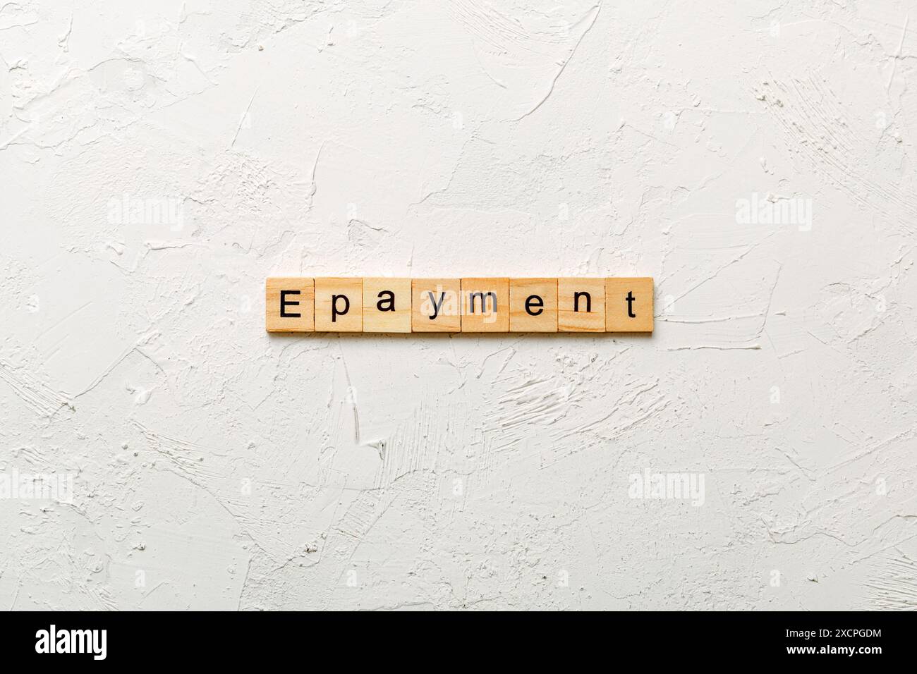 E-payment word written on wood block. E-payment text on cement table ...