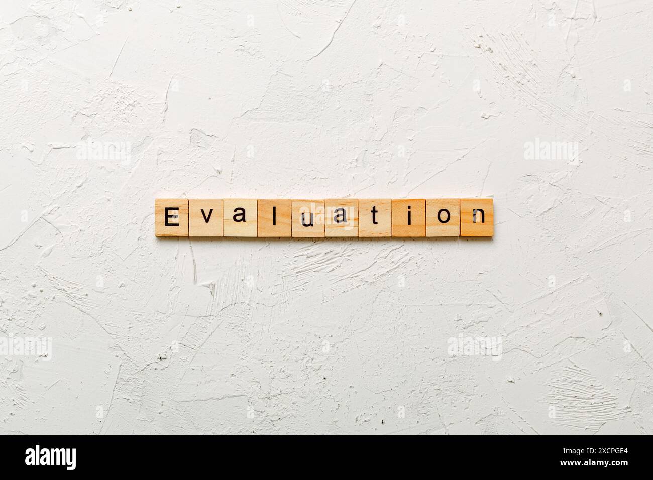 evaluation word written on wood block. evaluation text on table ...