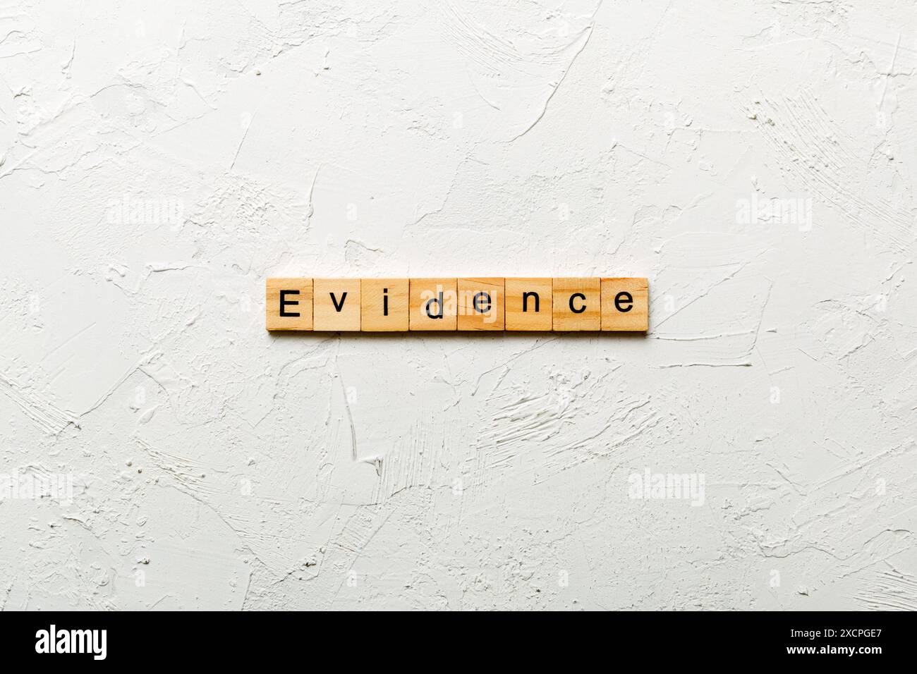 evidence word written on wood block. evidence text on table, concept ...