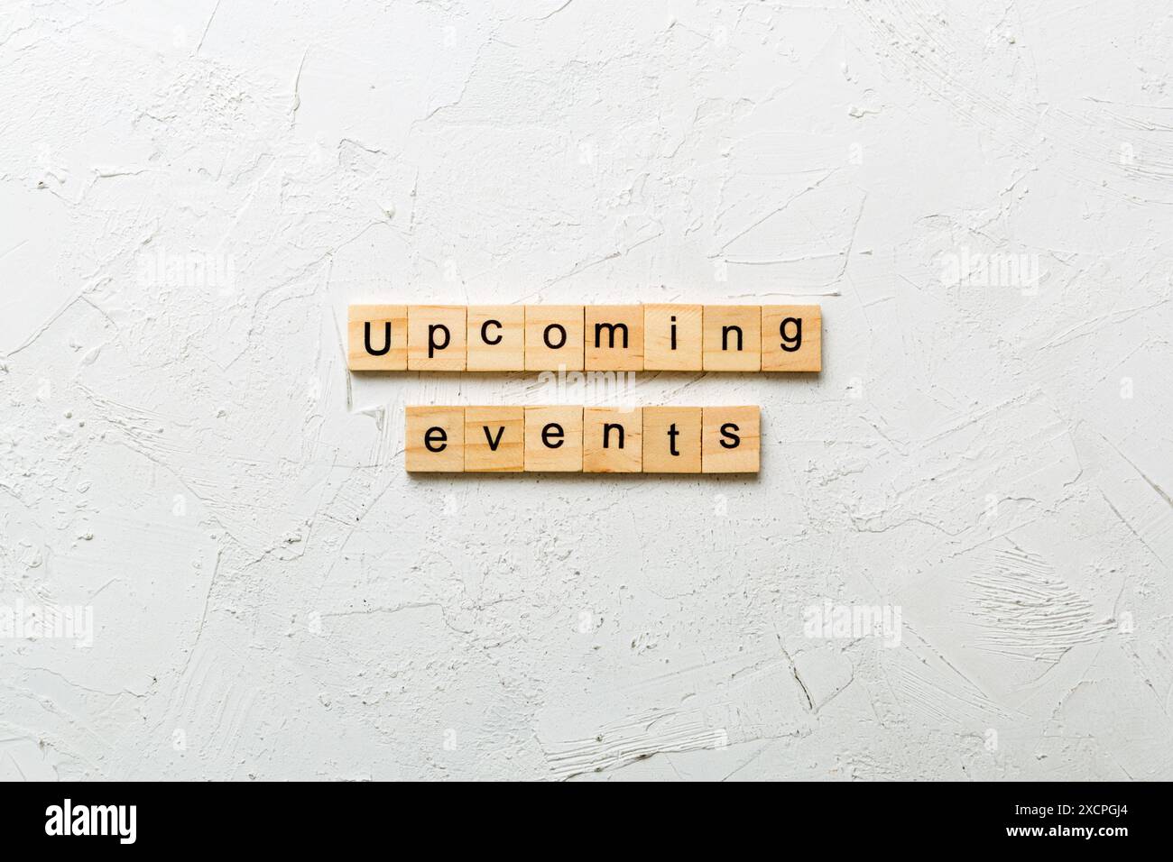 upcoming evente word written on wood block. upcoming evente text on ...