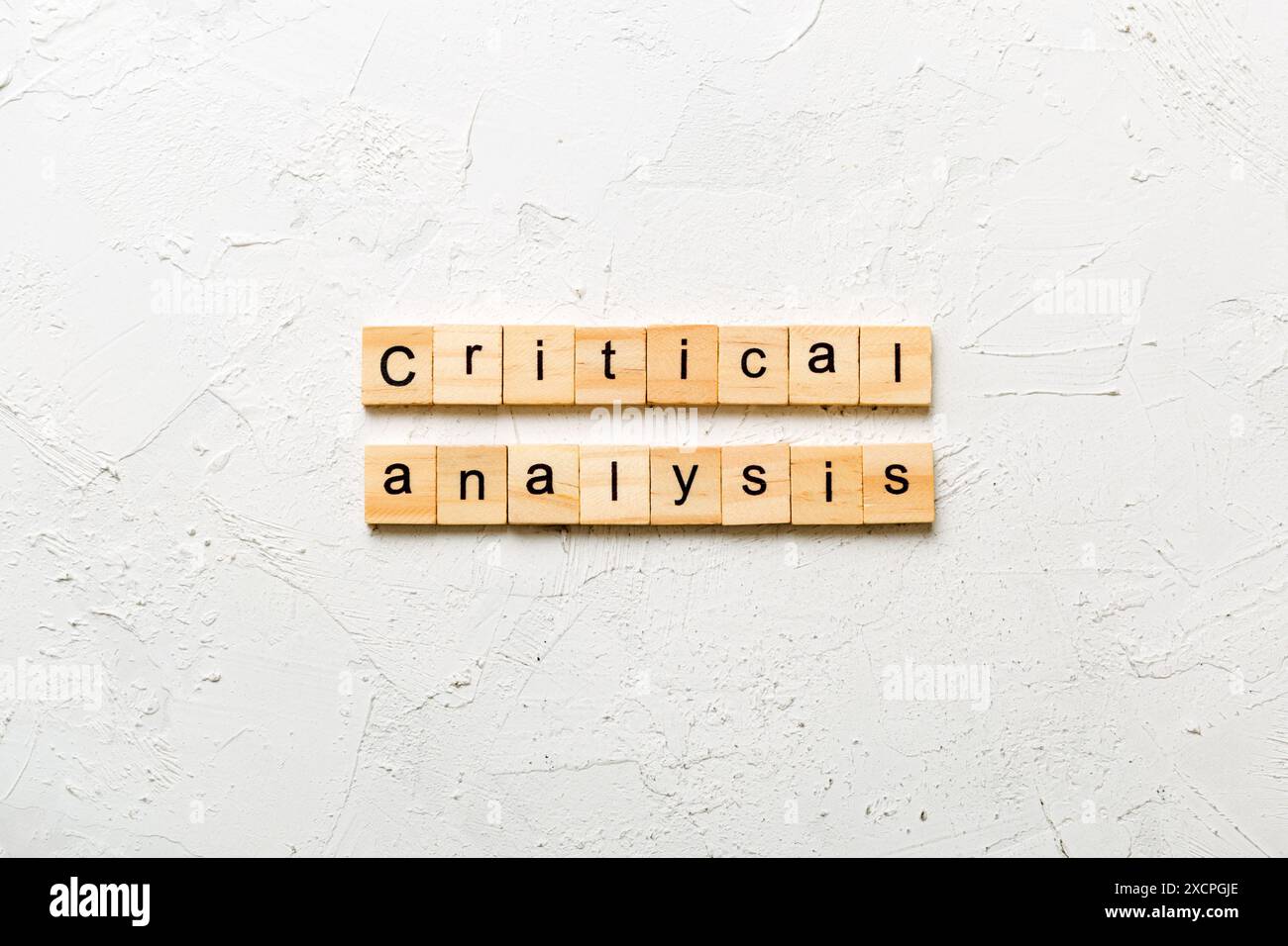 critical analysis content word written on wood block. critical analysis ...