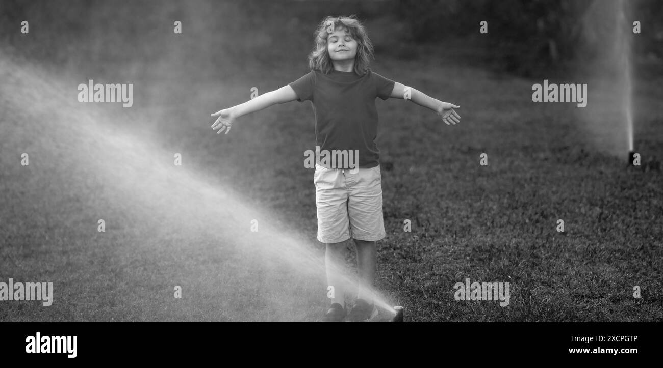 Cute little kid play in garden at summer day. Child enjoy summer in ...