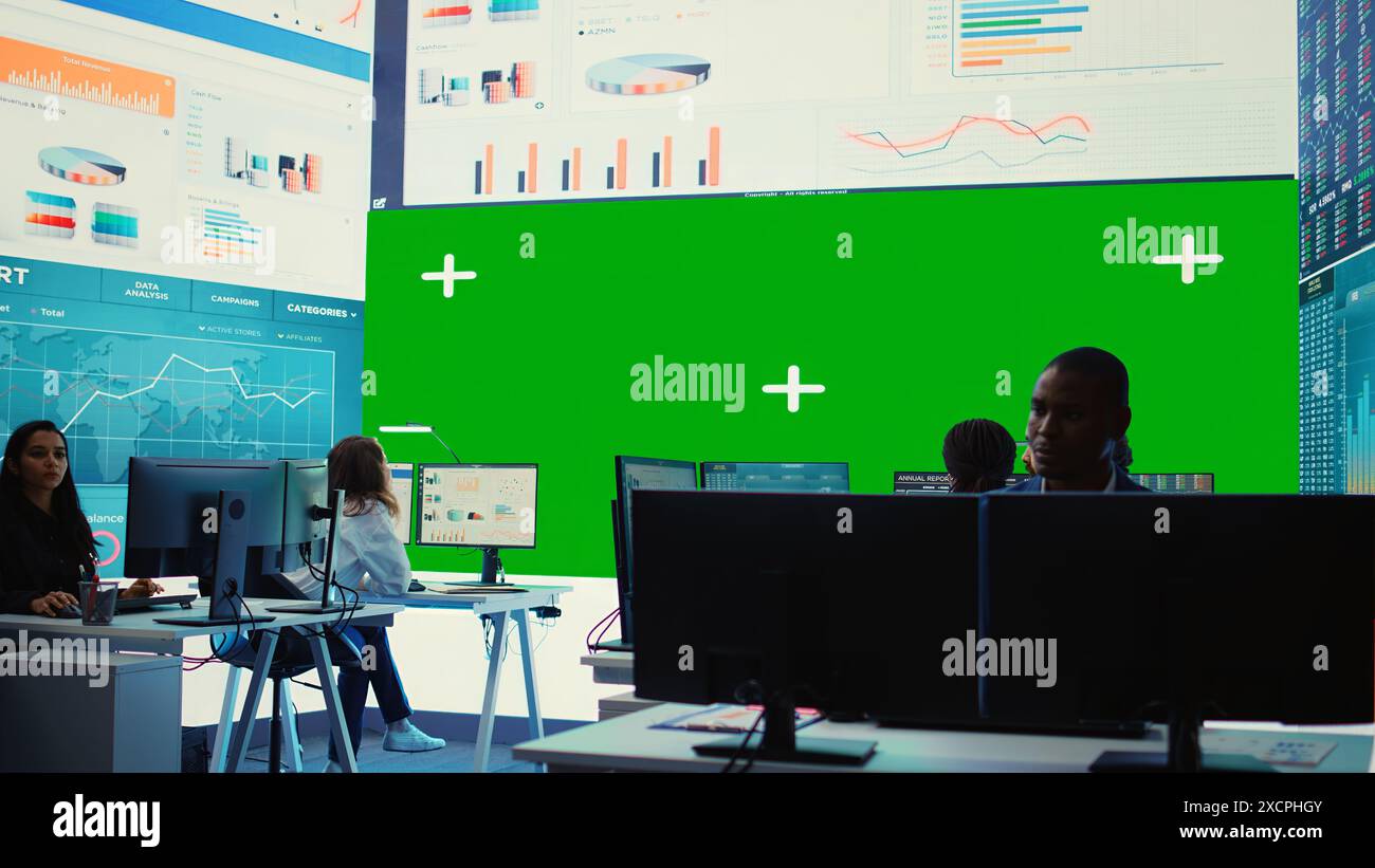 Diverse group of business specialists solve their daily tasks in ...