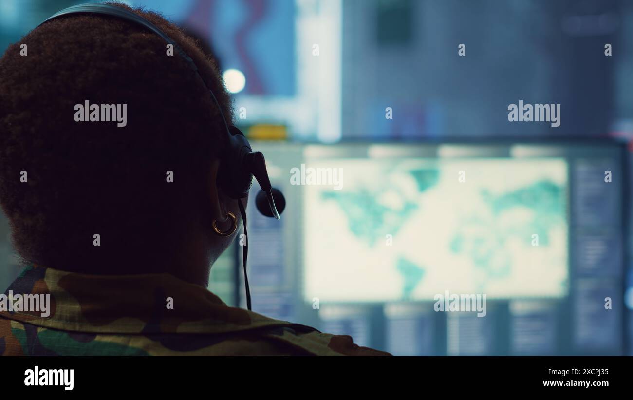Woman military personnel tracking enemy vessels on the coast line ...