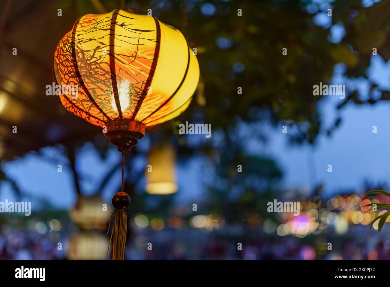 Traditional colorful silk lanterns in souvenir shop at Hoi An Ancient Town. Hoian is a popular ...