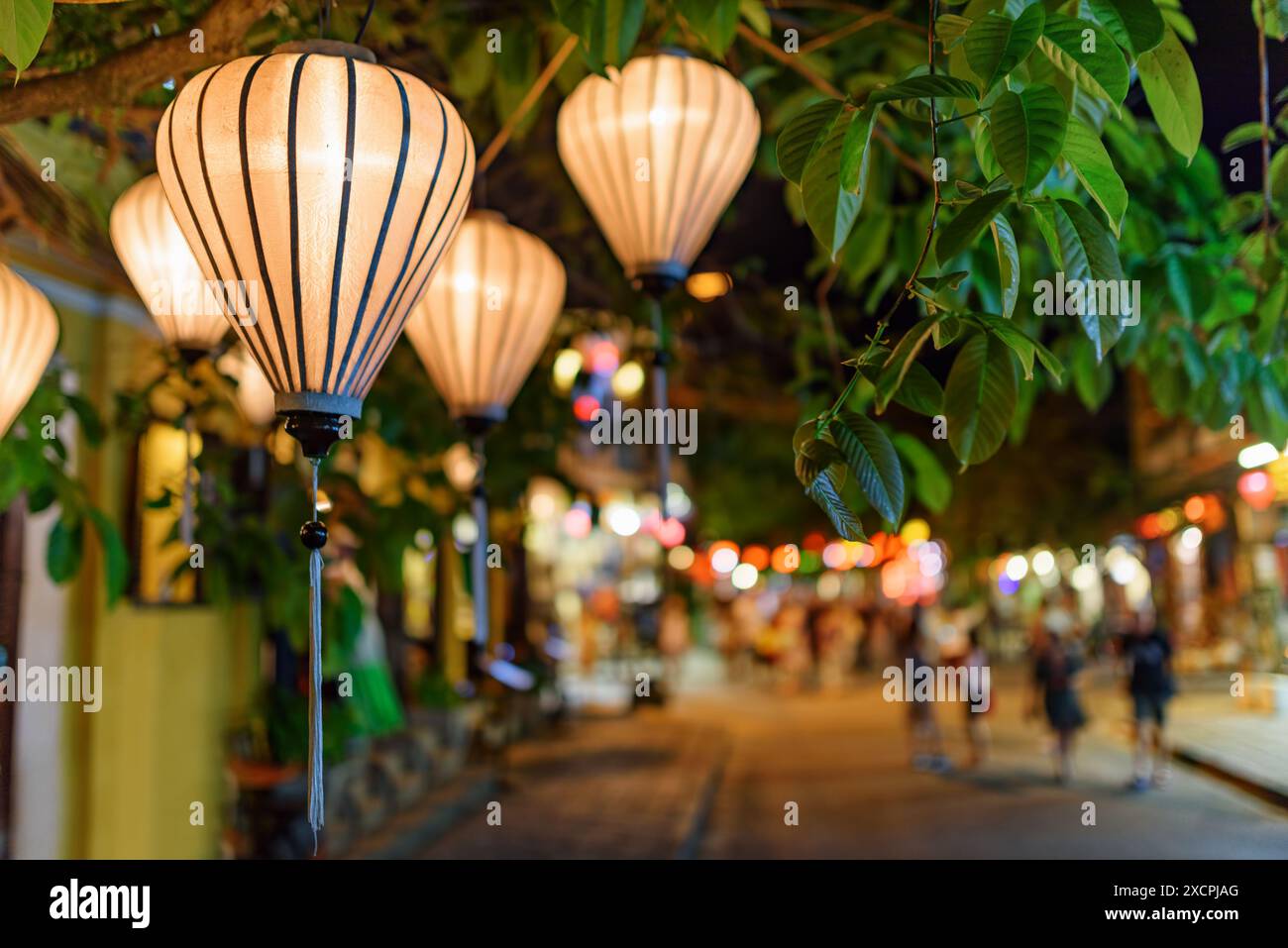 Traditional colorful silk lanterns in souvenir shop at Hoi An Ancient Town. Hoian is a popular ...