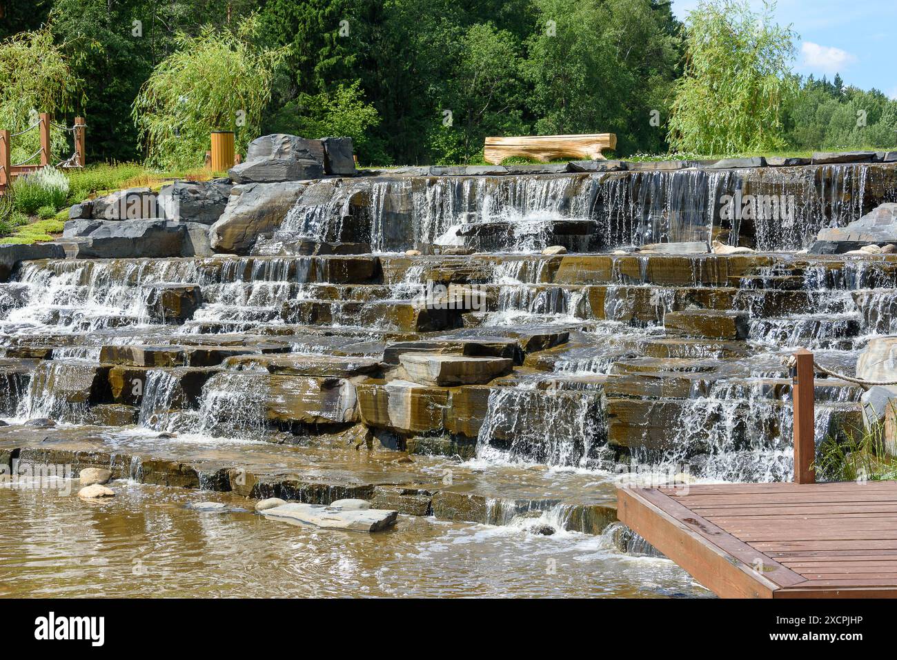 Cascade of artificial waterfalls on a water staircase on the riverbed ...