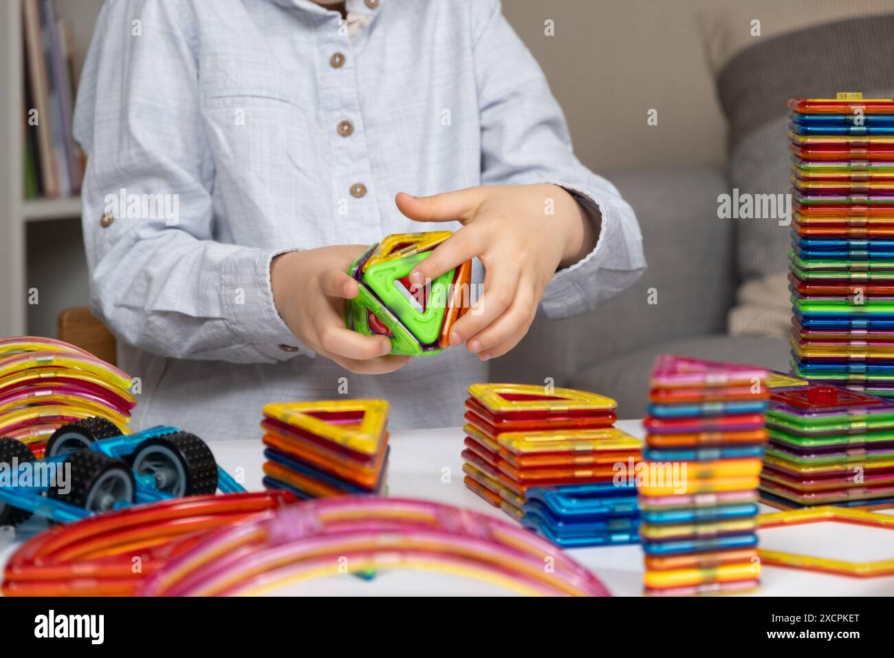 Child playing magnetic constructor hands hi-res stock photography and ...