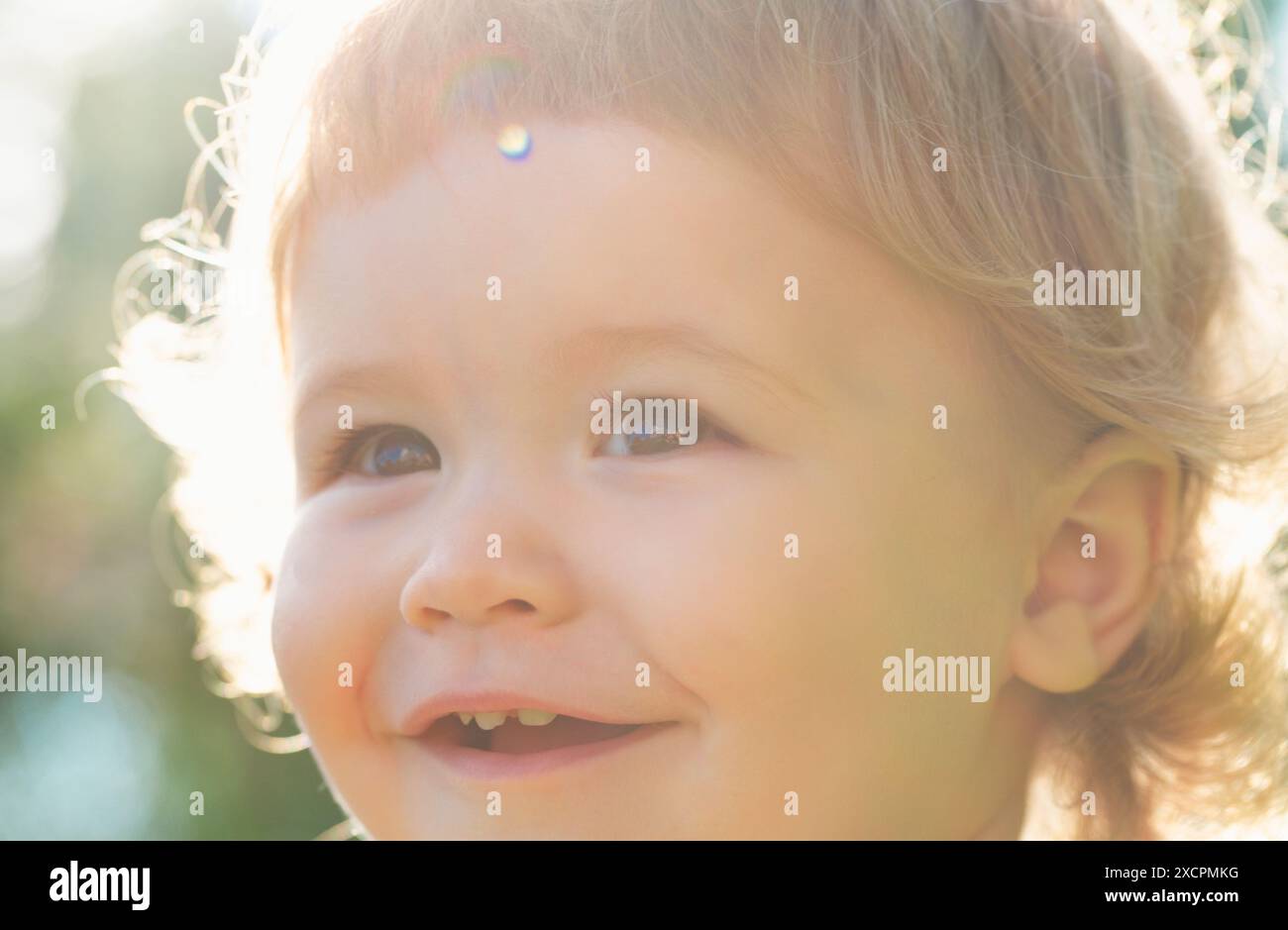 Kids smiling, cute smile. Funny child cropped face close up. Baby head ...