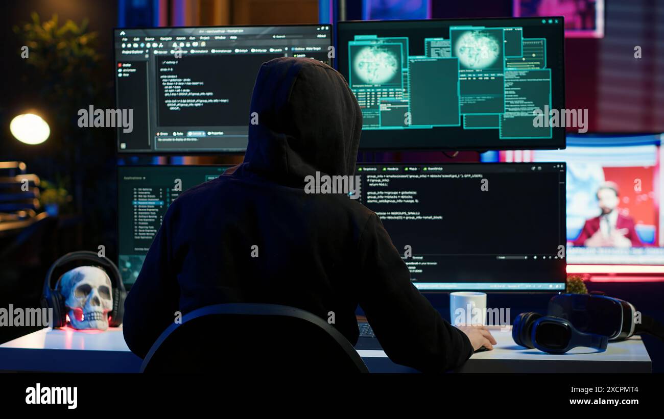 Malicious man hacking, stealing credit card numbers and manipulating banking systems for own ...