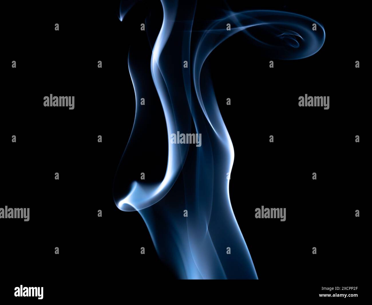 An abstract smoke art on a black background with intricate swirling ...