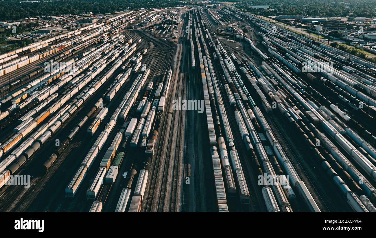 An aerial view of a large rail yard with numerous trains and tracks in ...