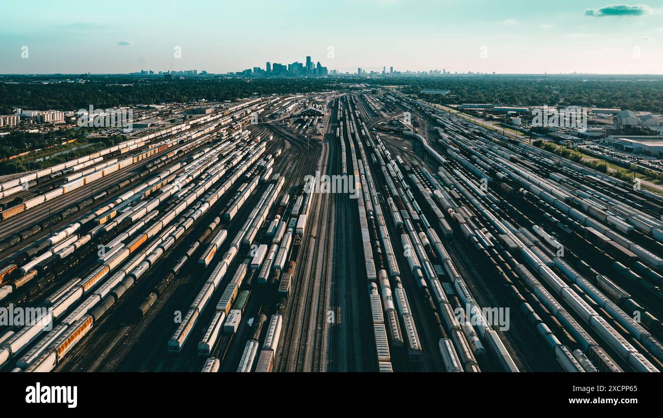 An aerial view of a large rail yard with numerous trains and tracks in ...