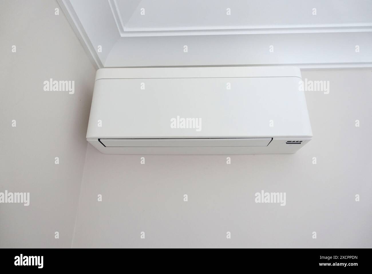Internal air conditioning unit mounted on a wall Stock Photo - Alamy