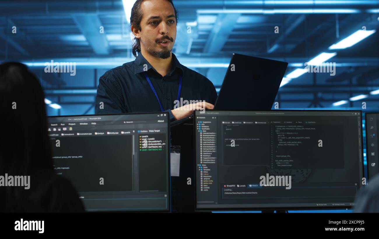 Manager In Data Center Doing Annual System Review Checking Parameters On Laptop Supervisor