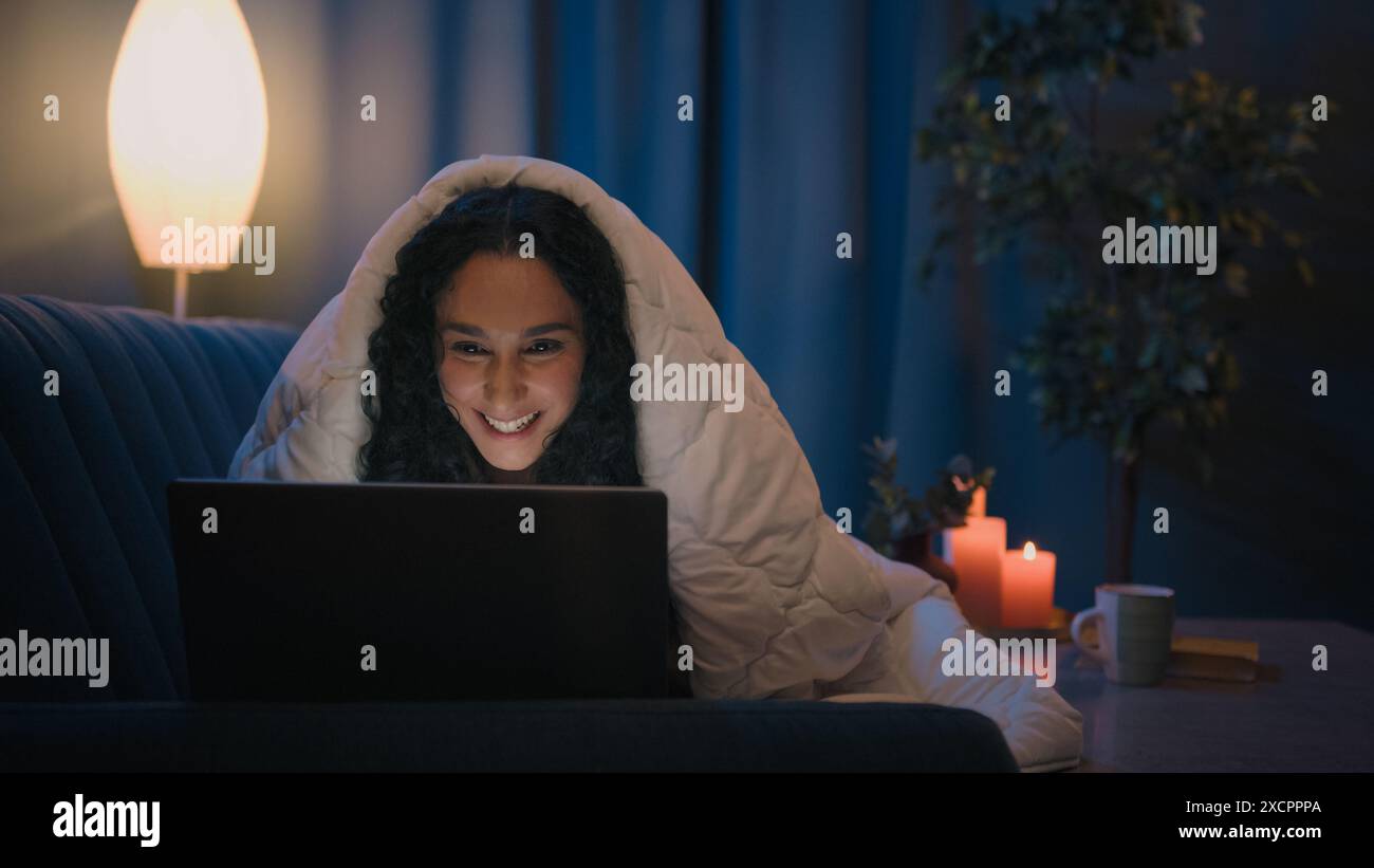 Hispanic smiling happy laughing woman Arabian girl using computer ...