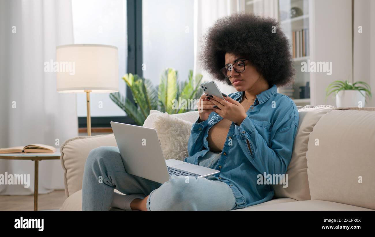 African American woman confused puzzled pensive ethnic girl with laptop ...