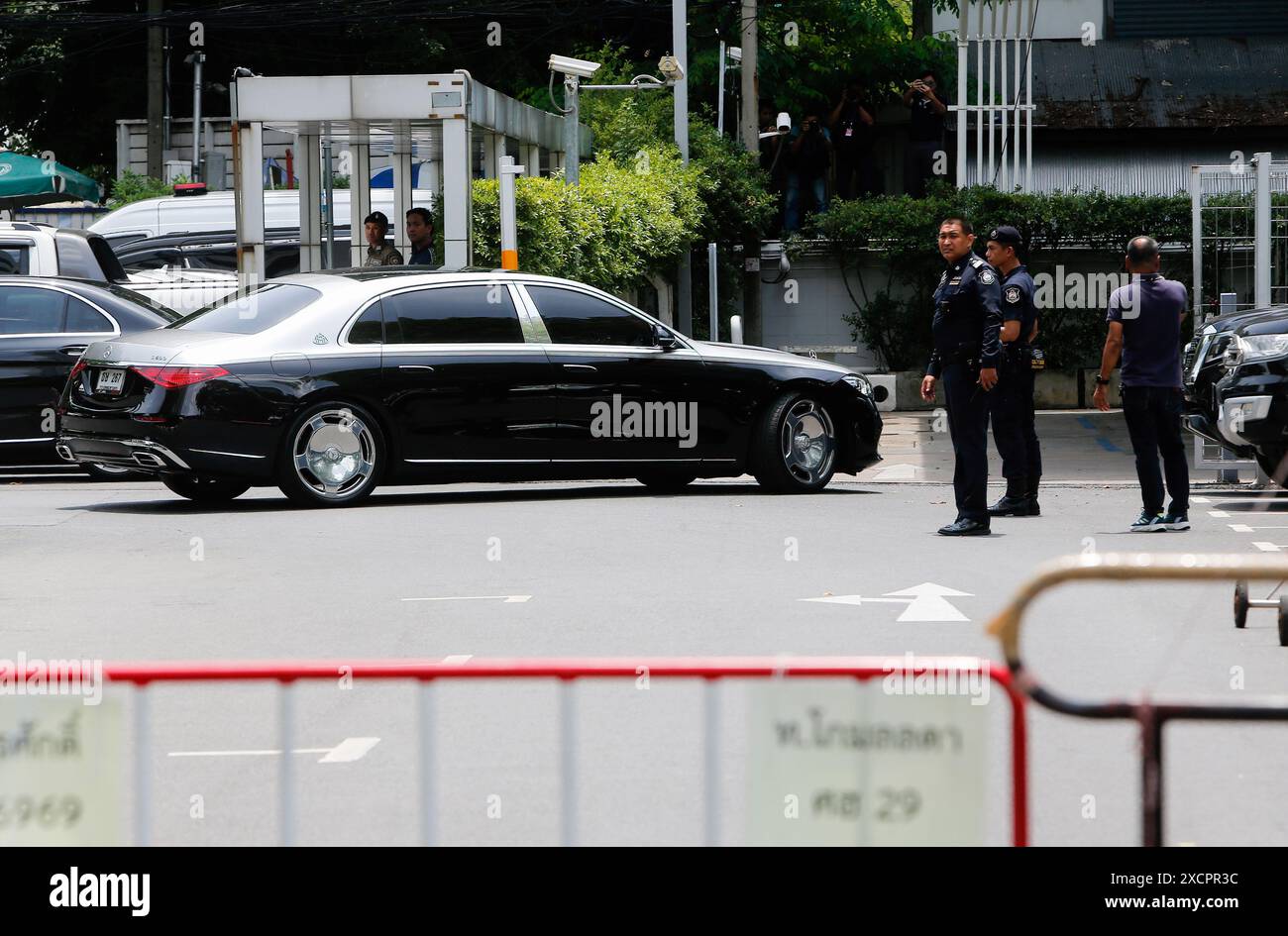Former Thai Prime Minister Thaksin Shinawatra inside a vehicle leaves the Criminal Court in ...