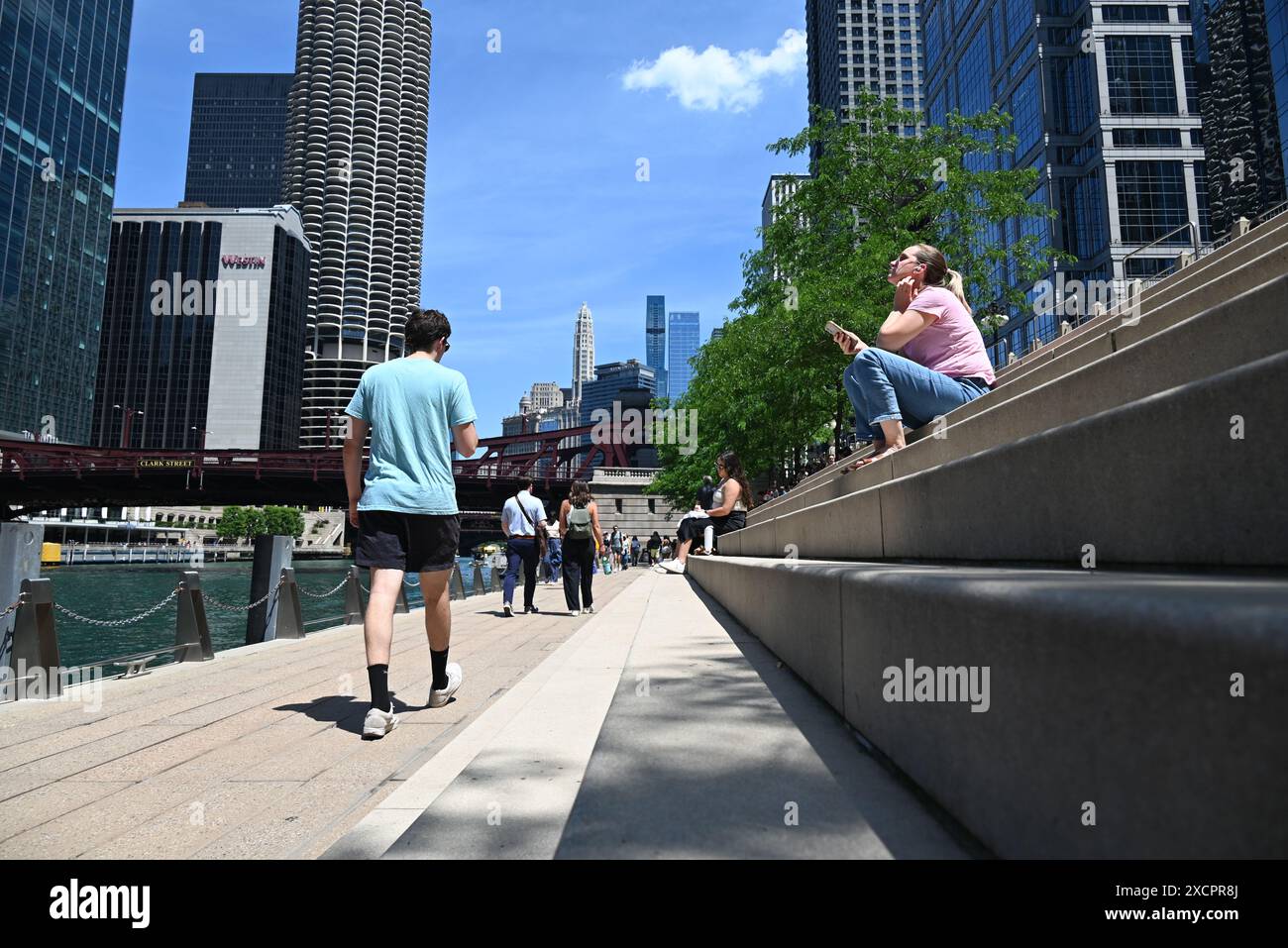 Chicagoans relax on the steps of the River Theater section of the ...