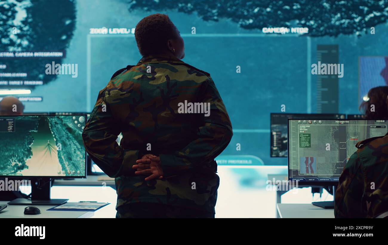 Woman Army Officer Coordinating Special Operations Mission In Command Post Monitoring