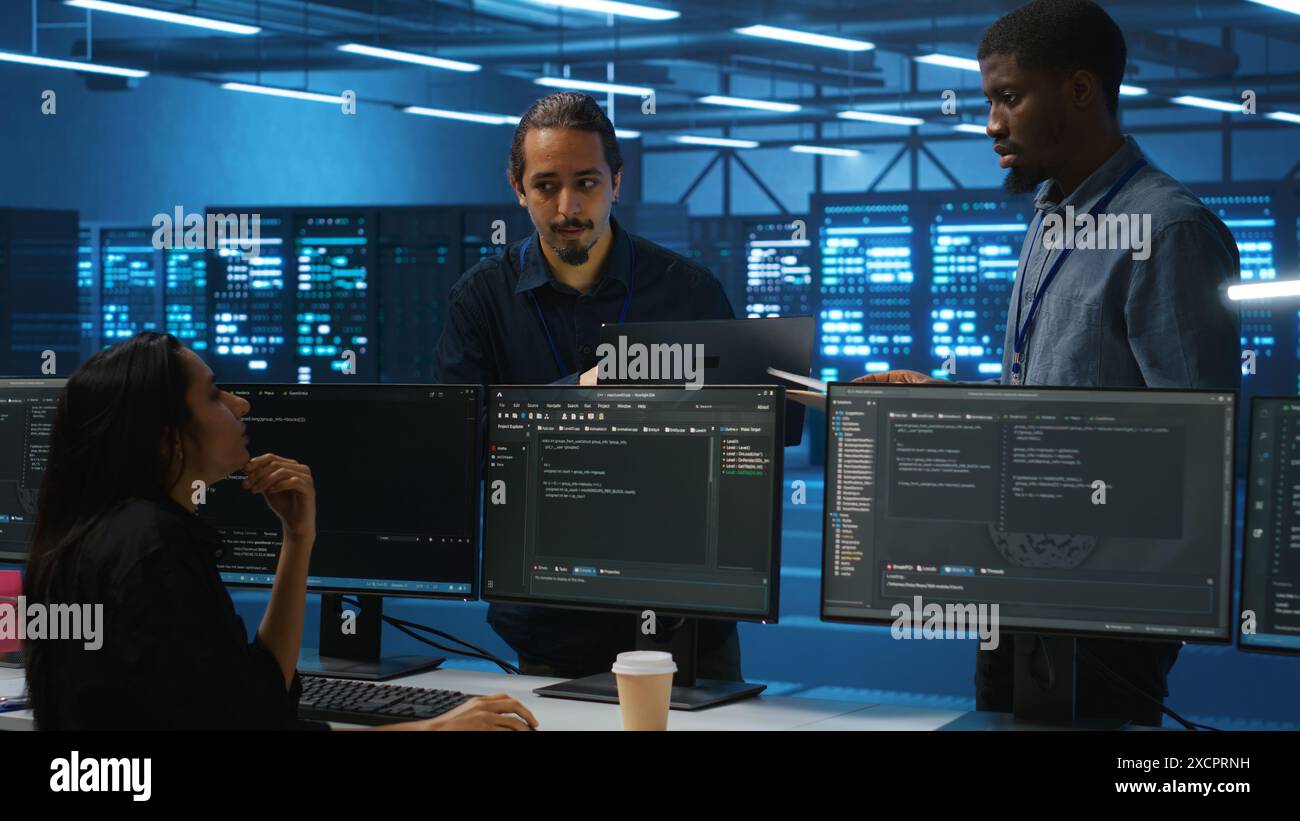 Man inspecting server farm, reading paperwork, following inspection ...