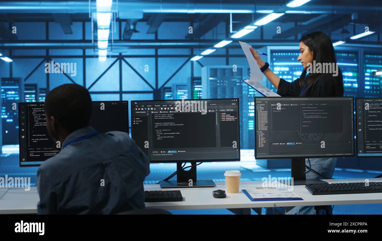 Indian manager in data center doing inspection on electronics and ...