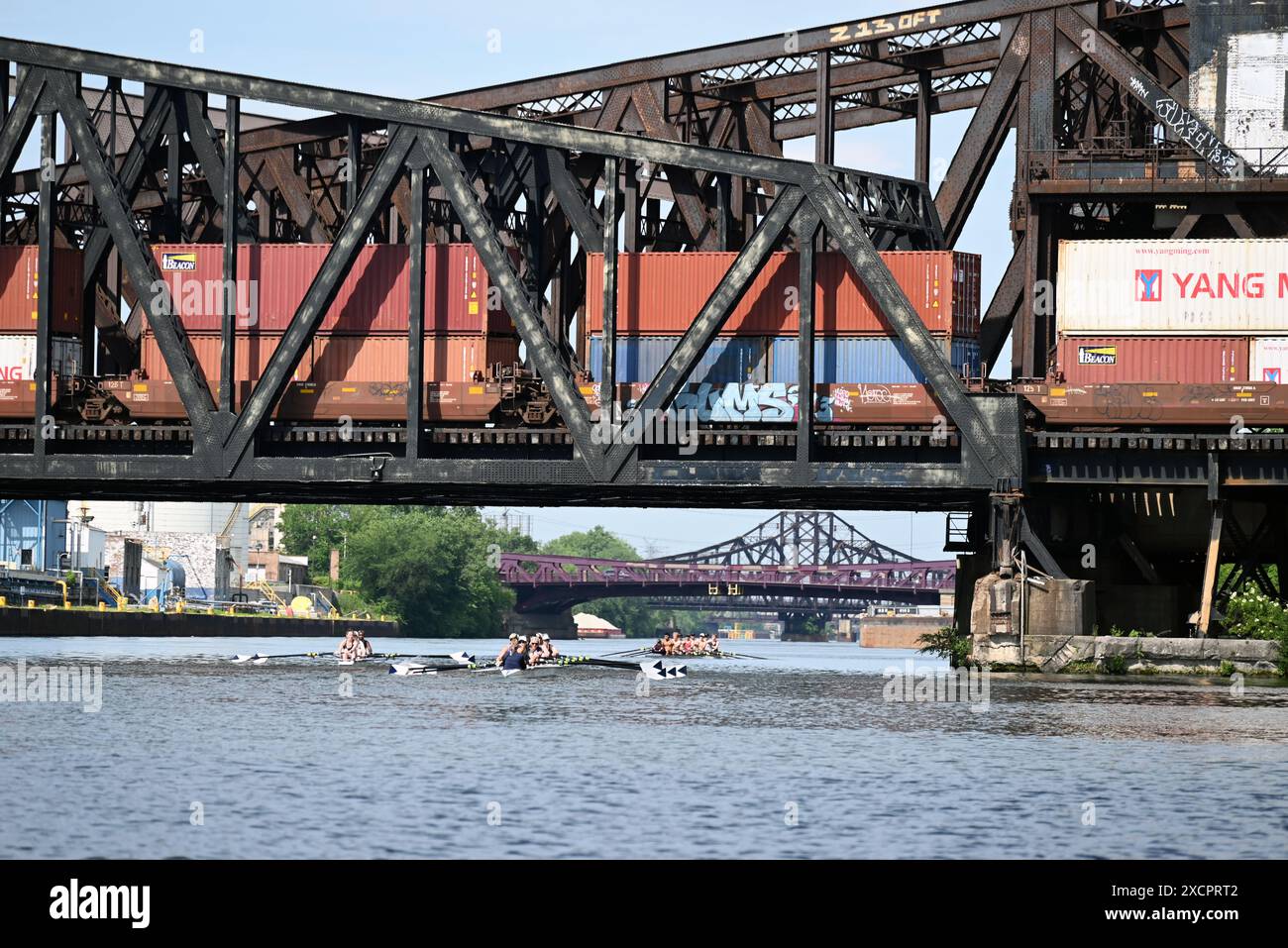 Rowing shells pass under a pair of bascule trunnion railway bridges ...