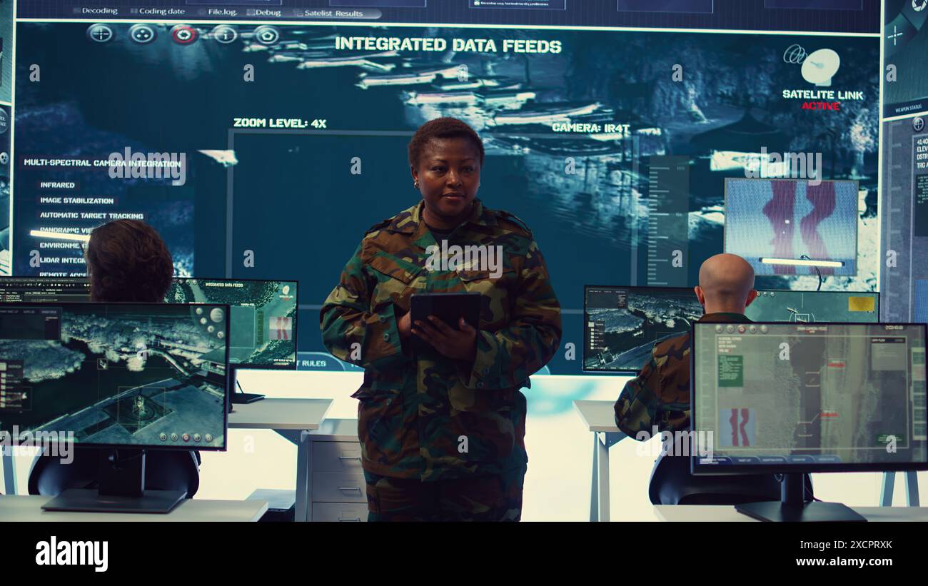 Woman sergeant major working on deployment of electronic warfare tools ...