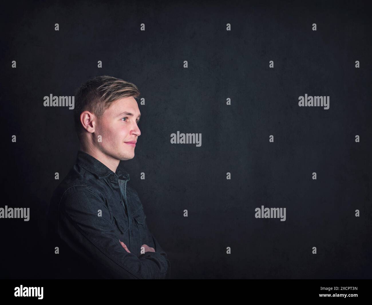 Positive thinking young man side view portrait, looks confident holding ...