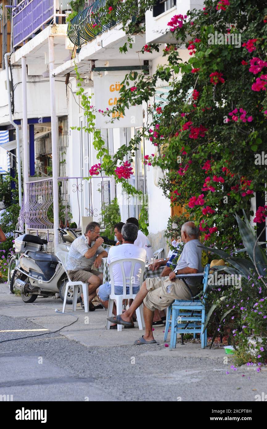 Local men drinking tea outside a house in Bozburn, Marmaris, Turkey ...