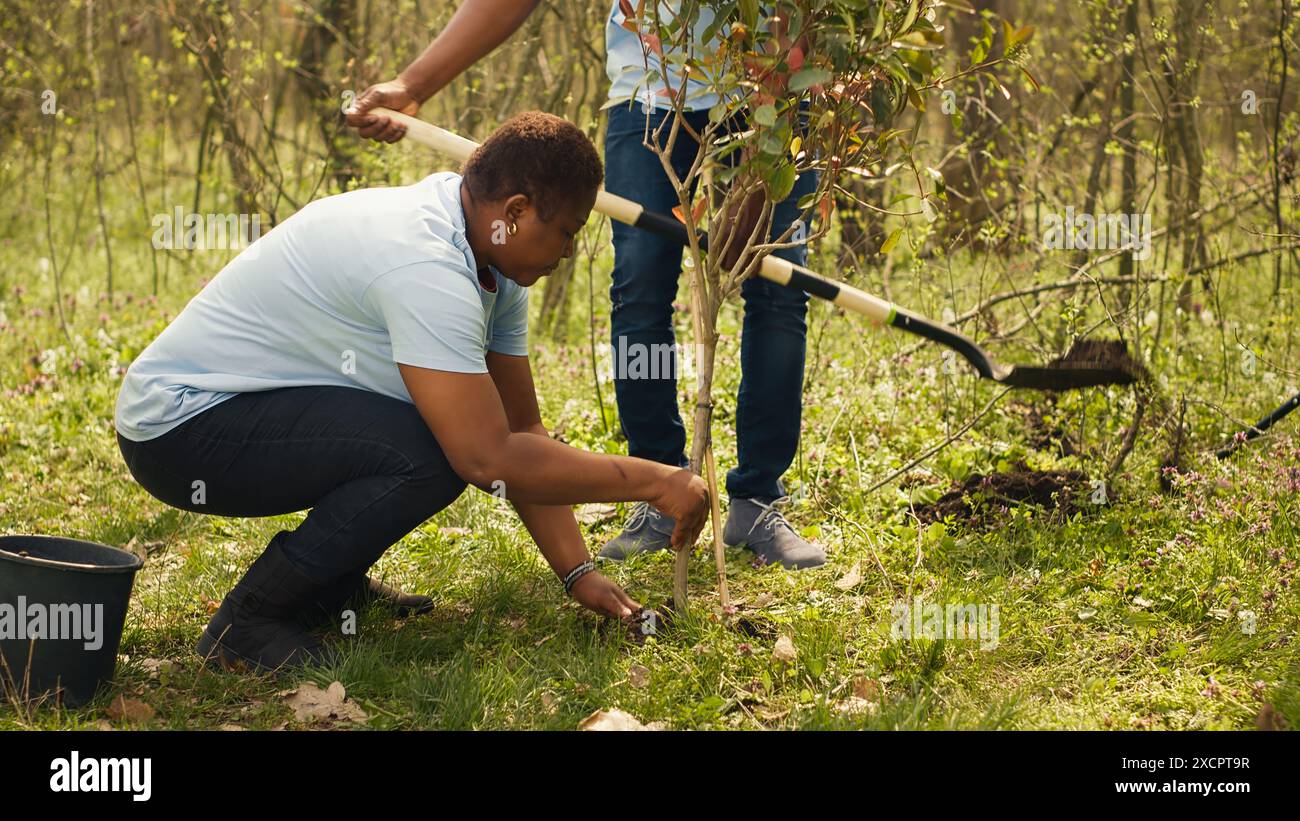 African american activists planting trees for nature preservation ...