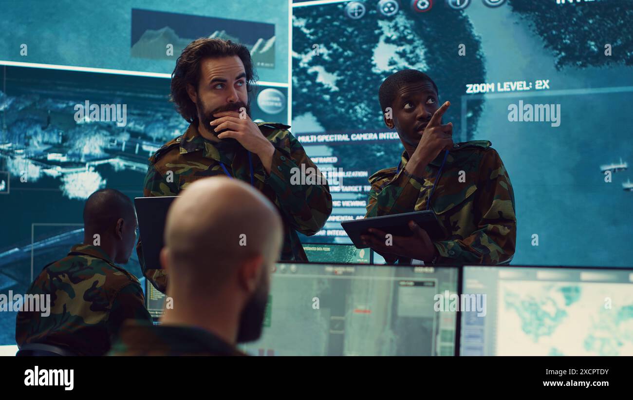 Diverse team of infantry unit leader and commander gather intelligence ...