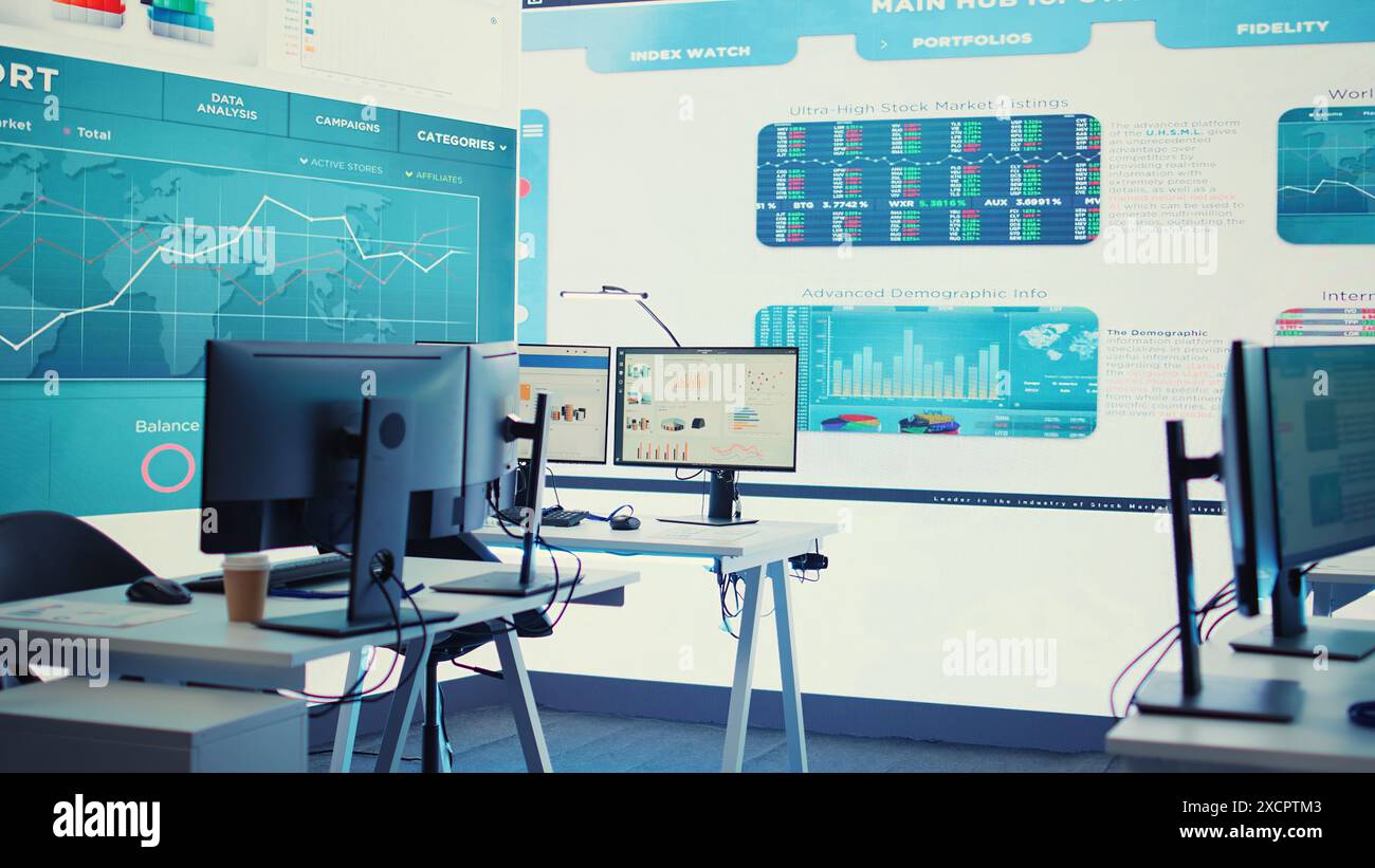 Empty boardroom space with multiple workstations having computers to ...