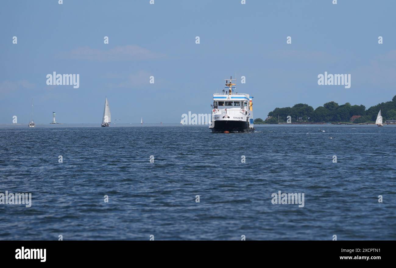 Kiel, Germany. 18th June, 2024. A ferry and numerous sailing boats sail ...