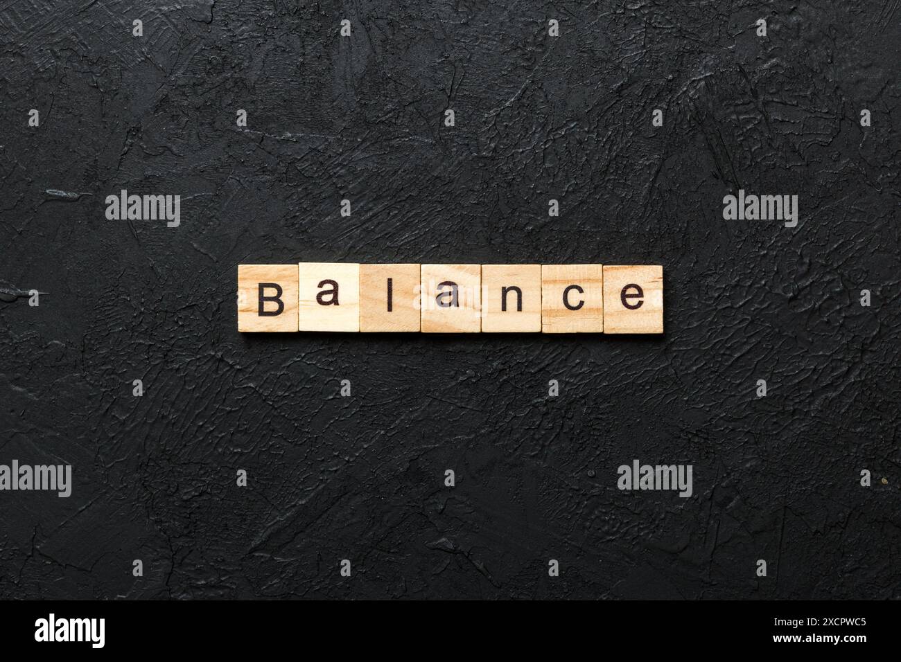 balance word written on wood block. balance text on cement table for ...