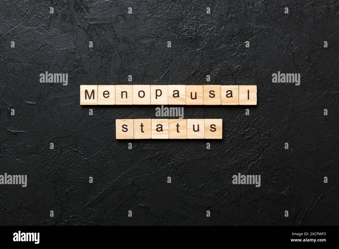 menopausal status word written on wood block. menopause status text on ...