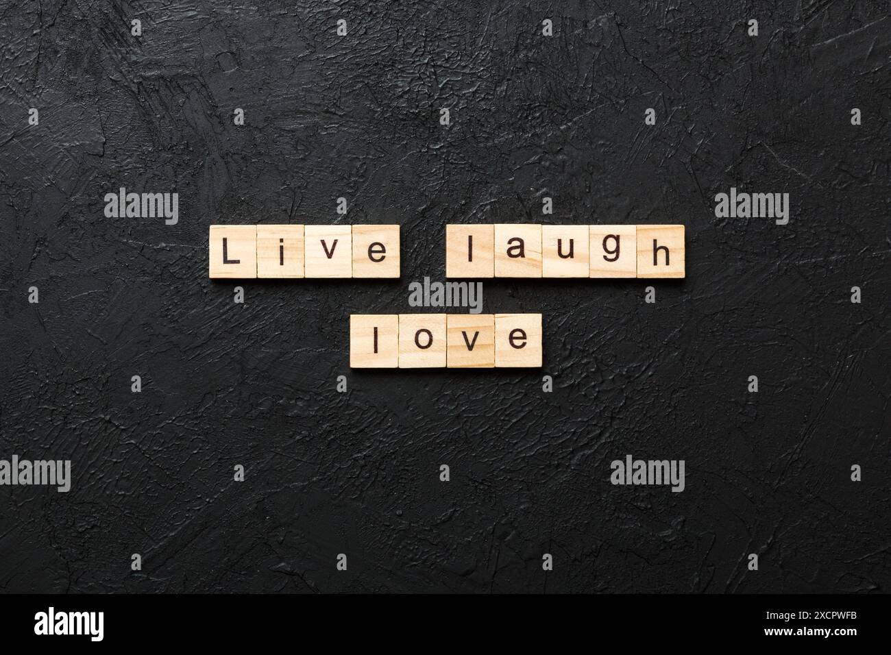 Live laugh love word written on wood block. Live laugh love text on ...