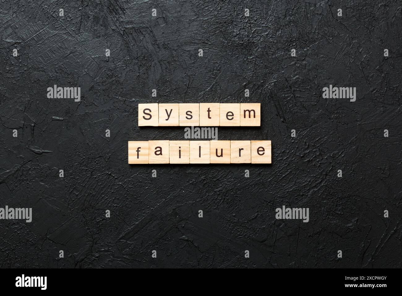 system failure word written on wood block. system failure text on table ...
