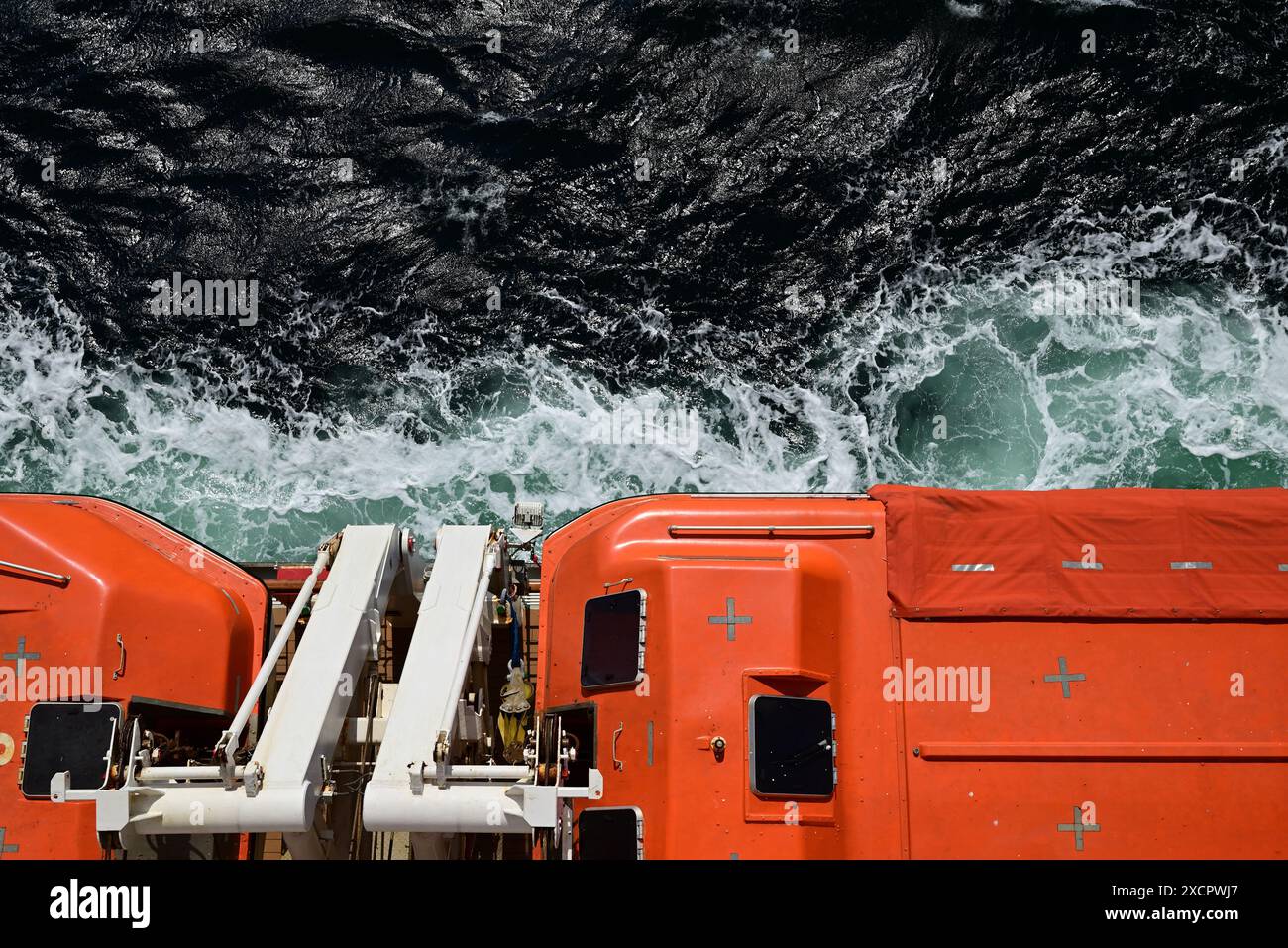 View from above the lifeboats of a cruise ship at sea. (Taken from the ...