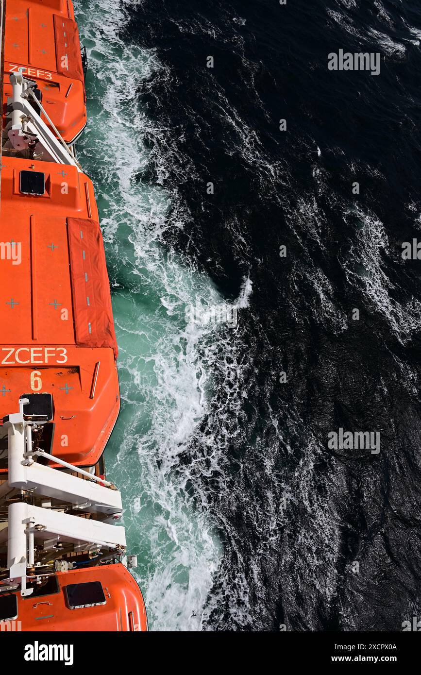 View from above the lifeboats of a cruise ship at sea. (Taken from the ...