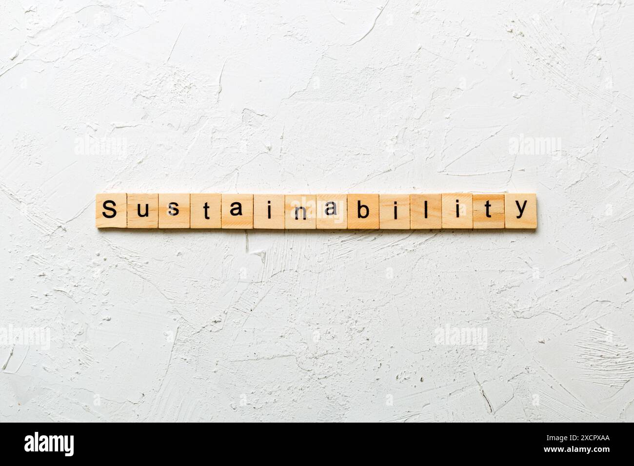 Sustainability word written on wood block. Sustainability text on table ...