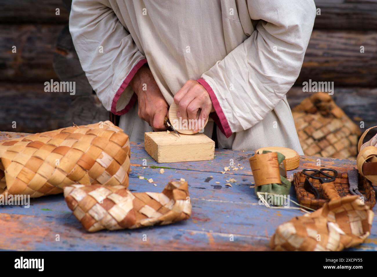 Making handicrafts from wood and birch bark in the old style Stock ...