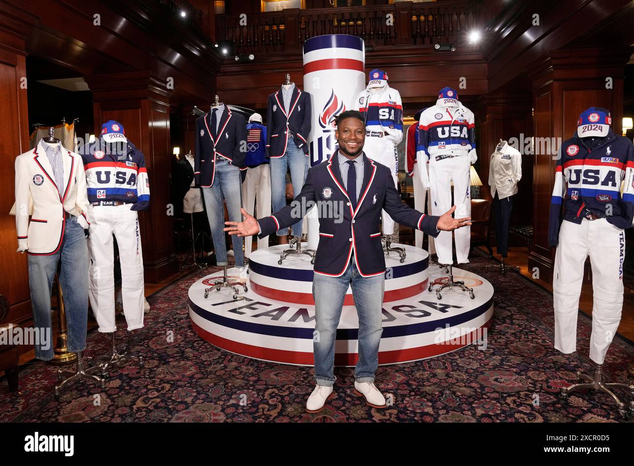 Olympic athlete in fencing, Daryl Homer, models the Team USA Paris ...