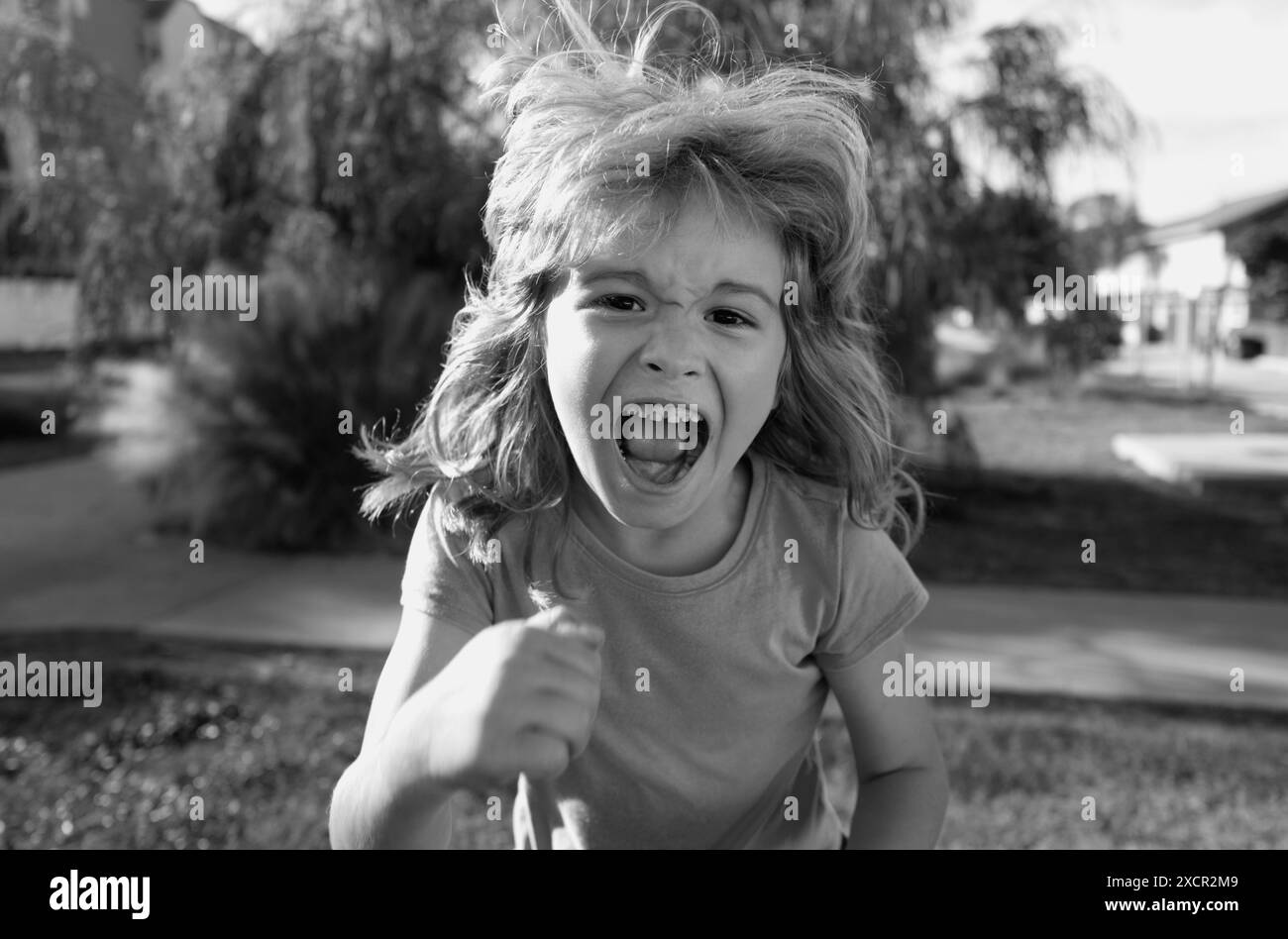 Enraged kid boy with angry expression. Angry hateful little rage boy ...