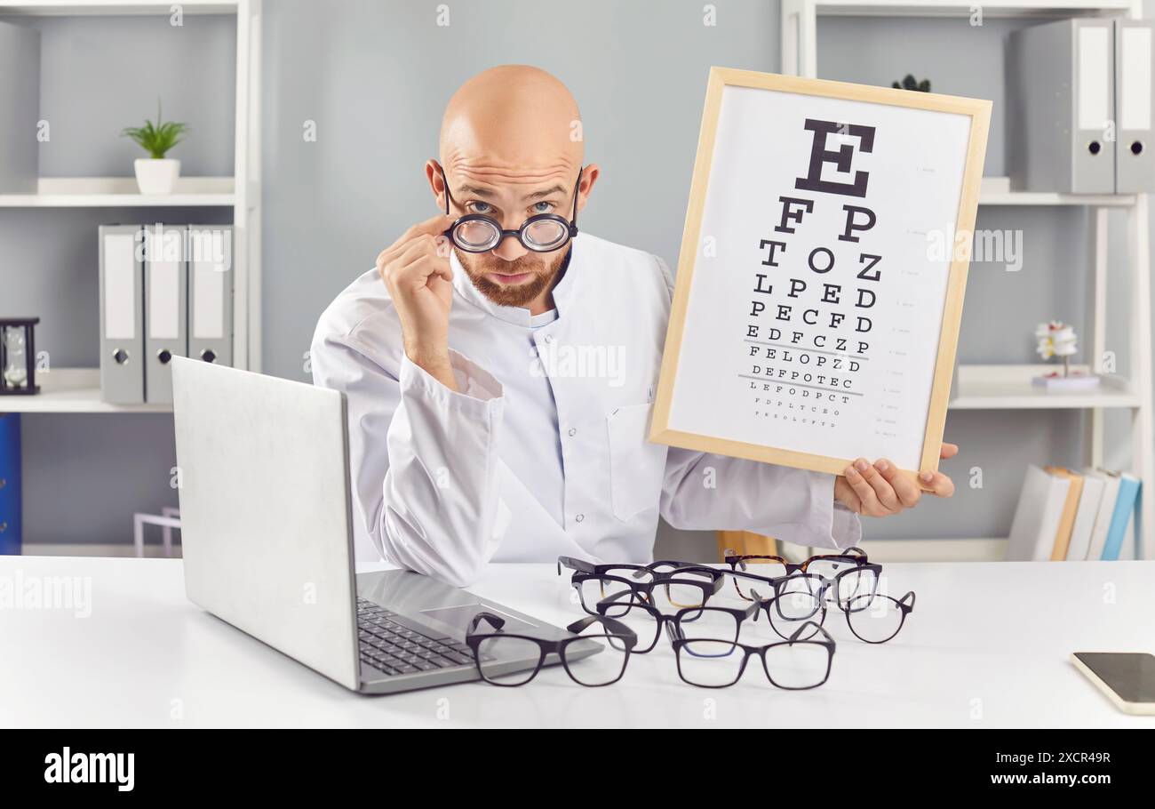 Portrait Of Funny Ophthalmologist Doctor With Eyeglasses And Eye Chart ...