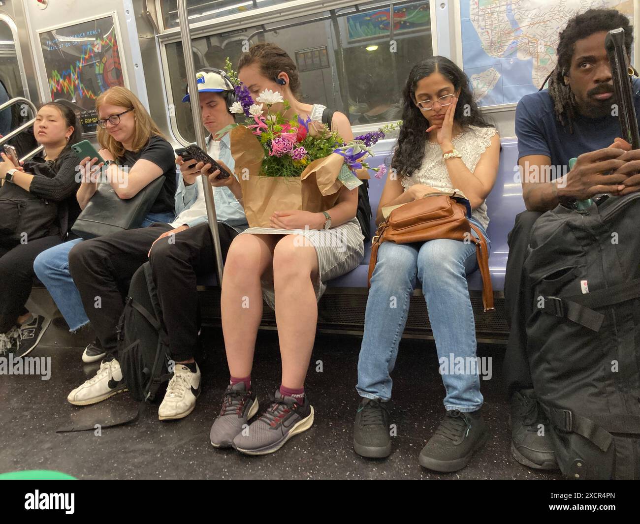 Subway riders in New York on Wednesday, June 5, 2024. (© Frances M ...