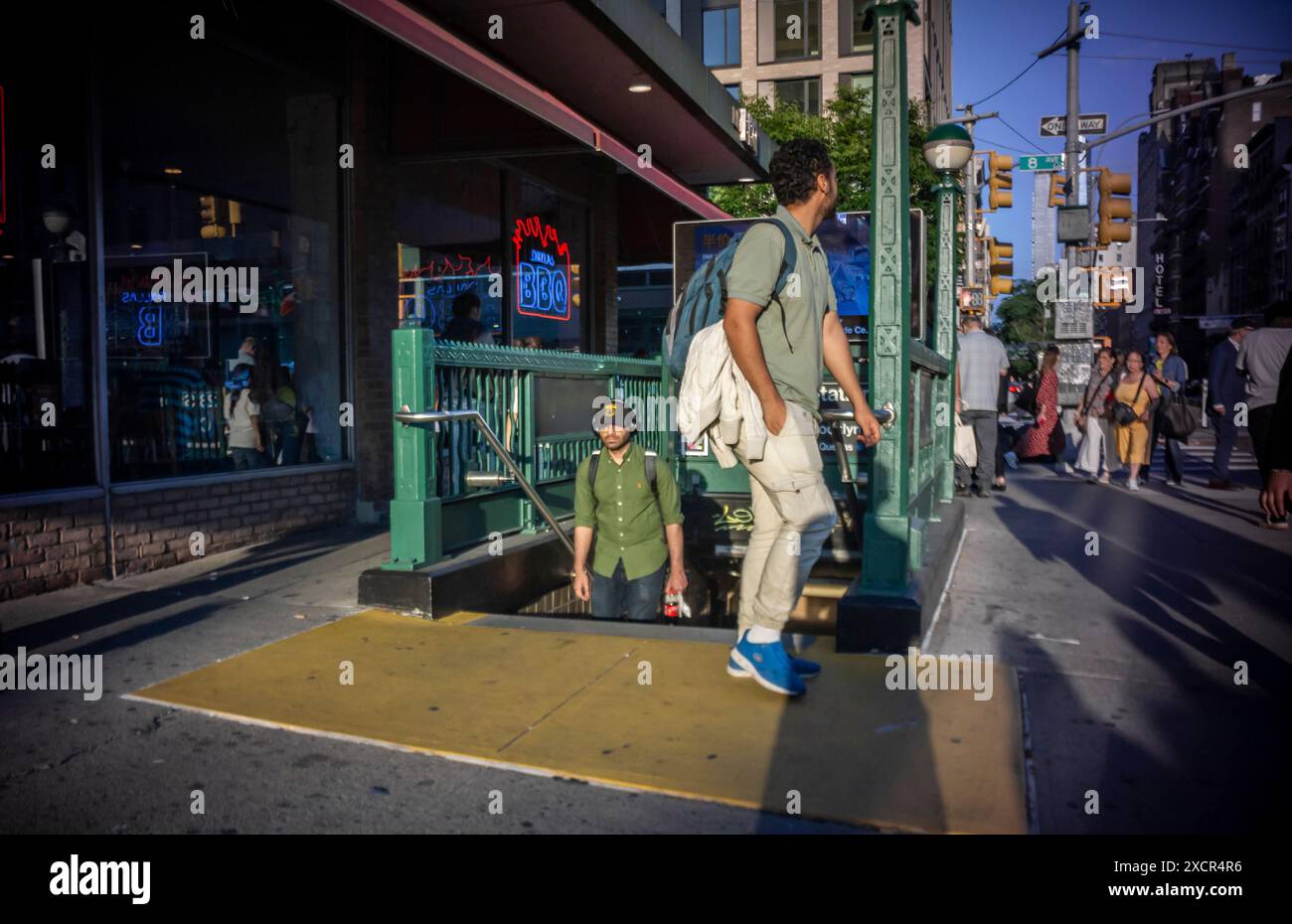 People exit the West 23rd Street subway station in the late afternoon ...