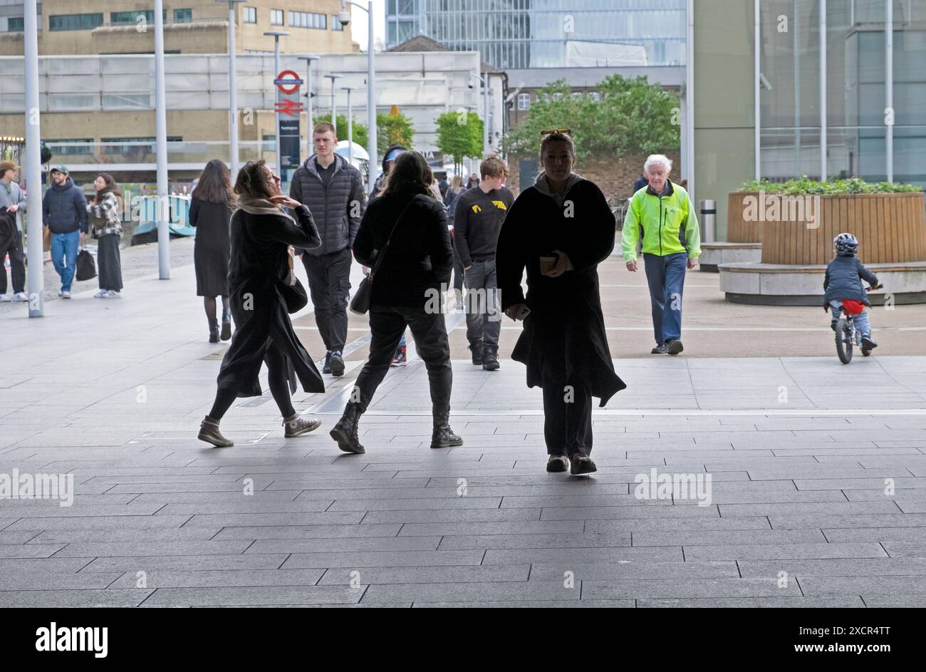 People tourists walking along pedestrian area Paddington Basin outside ...